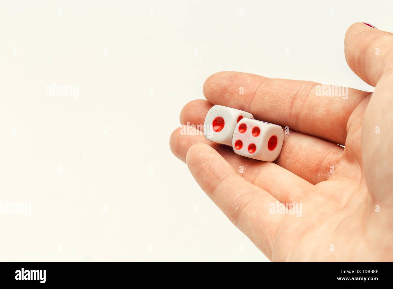 hand with a pair of dice Stock Photo - Alamy