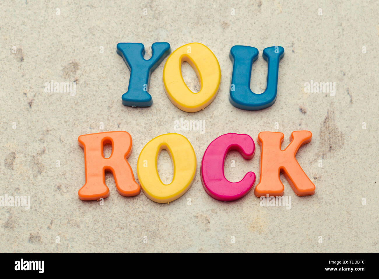 You rock compliment in colorful letters close up Stock Photo - Alamy