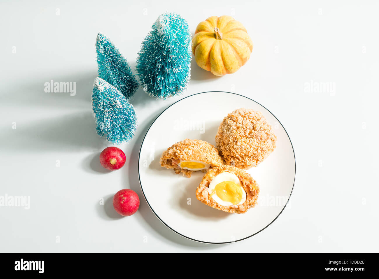 Scottish egg pendulum plate with white background Stock Photo - Alamy