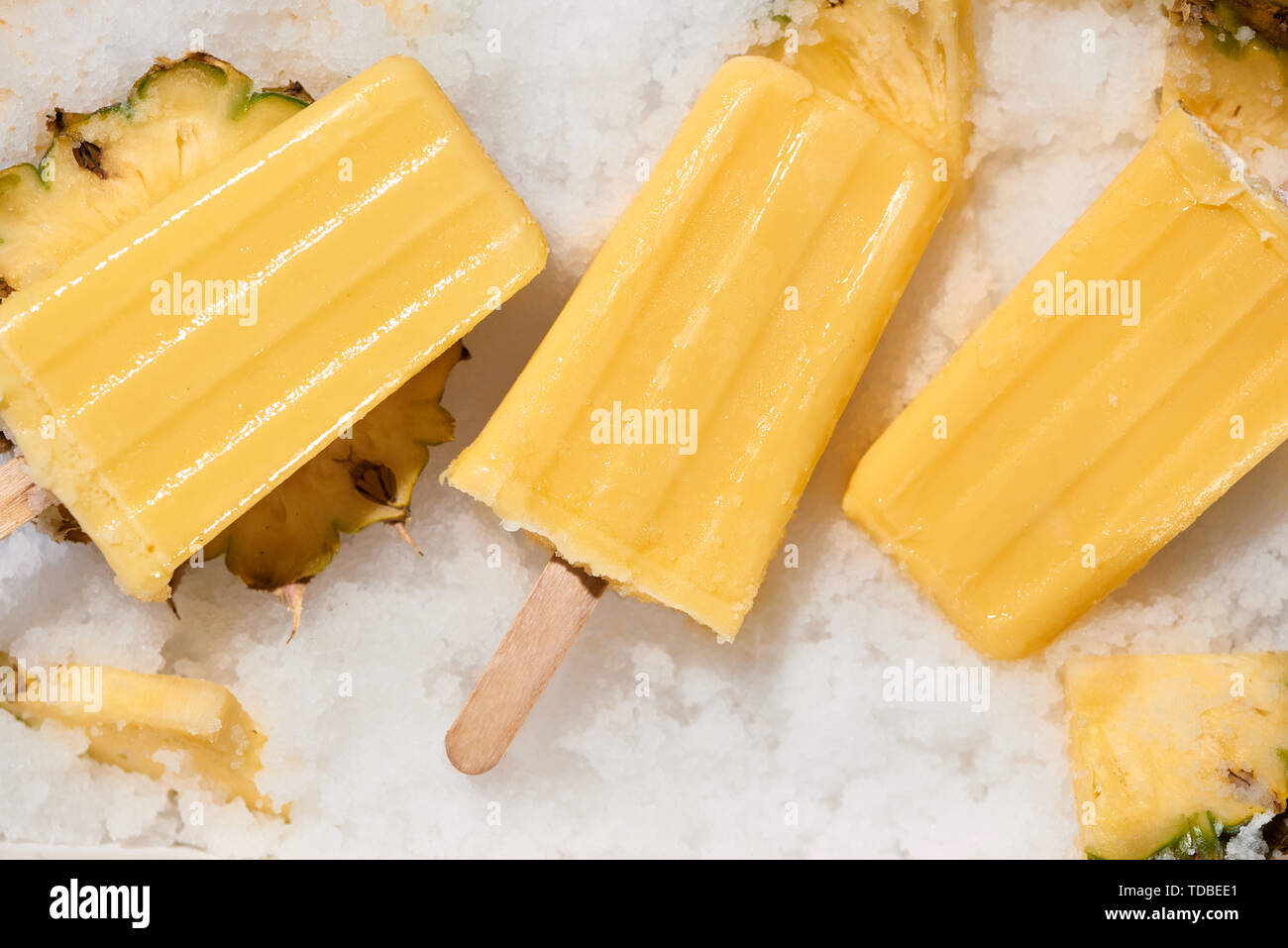 Yellow fruit popsicles on a tray top view, summer mood Stock Photo - Alamy