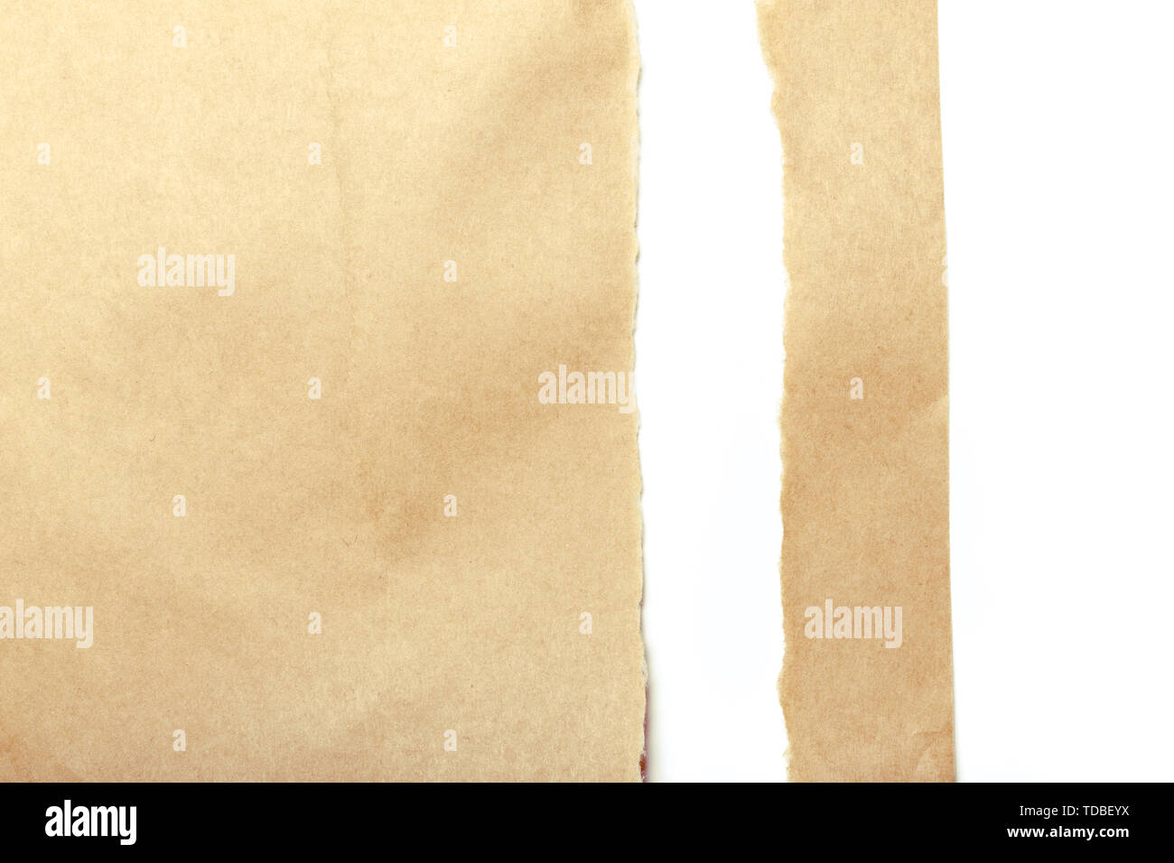 Brown package paper torn to reveal white panel Stock Photo - Alamy