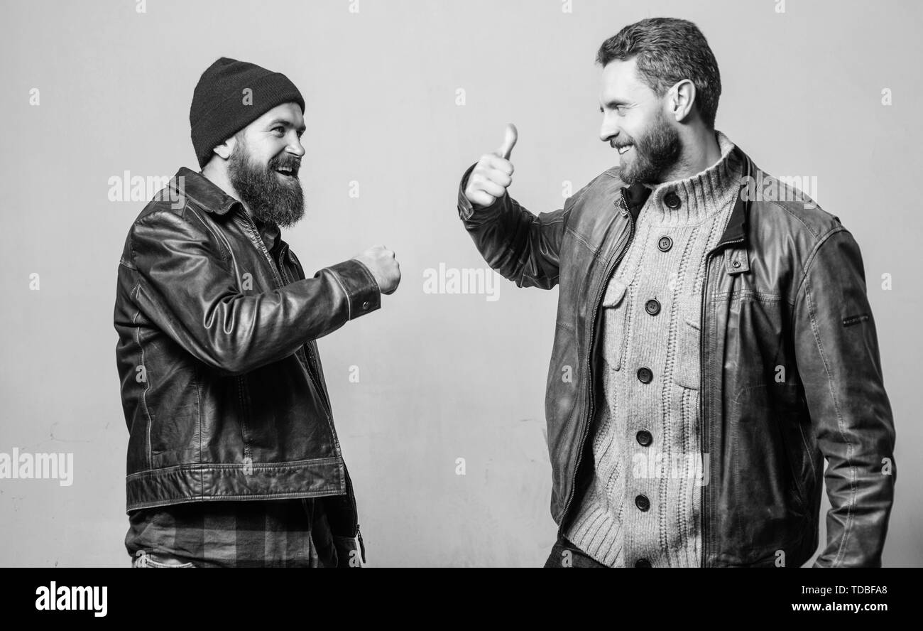 Male friendship concept. Brutal bearded men wear leather jackets. Real ...