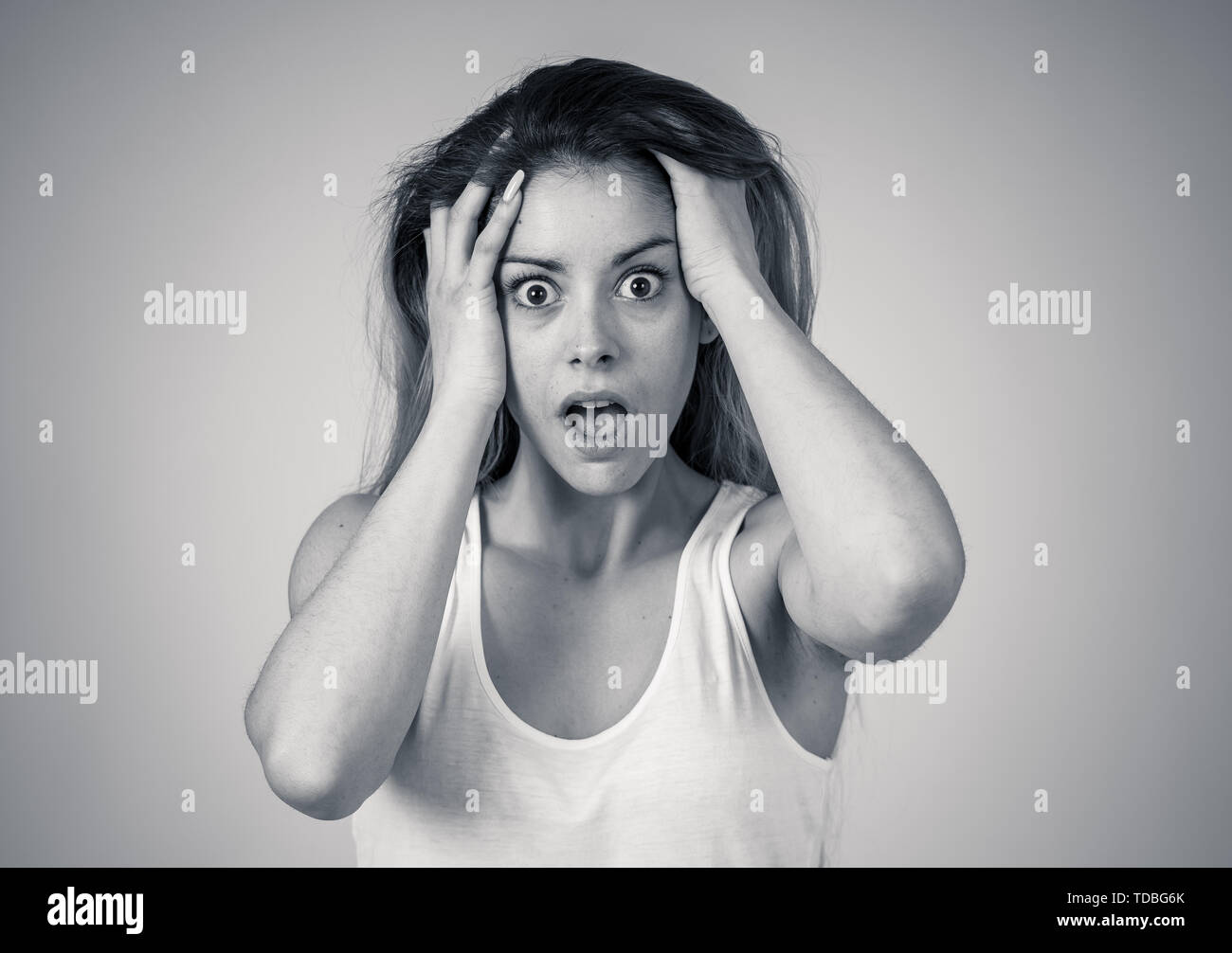 Beautiful young blonde woman with happy face making surprised gestures ...