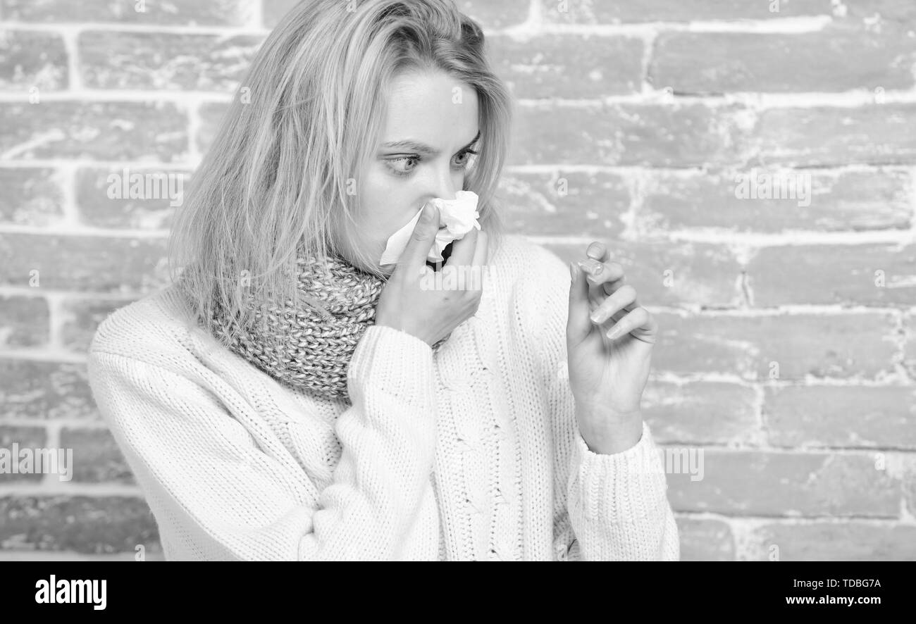 Becoming unwell with cold or flu. Sick woman holding fever thermometer ...