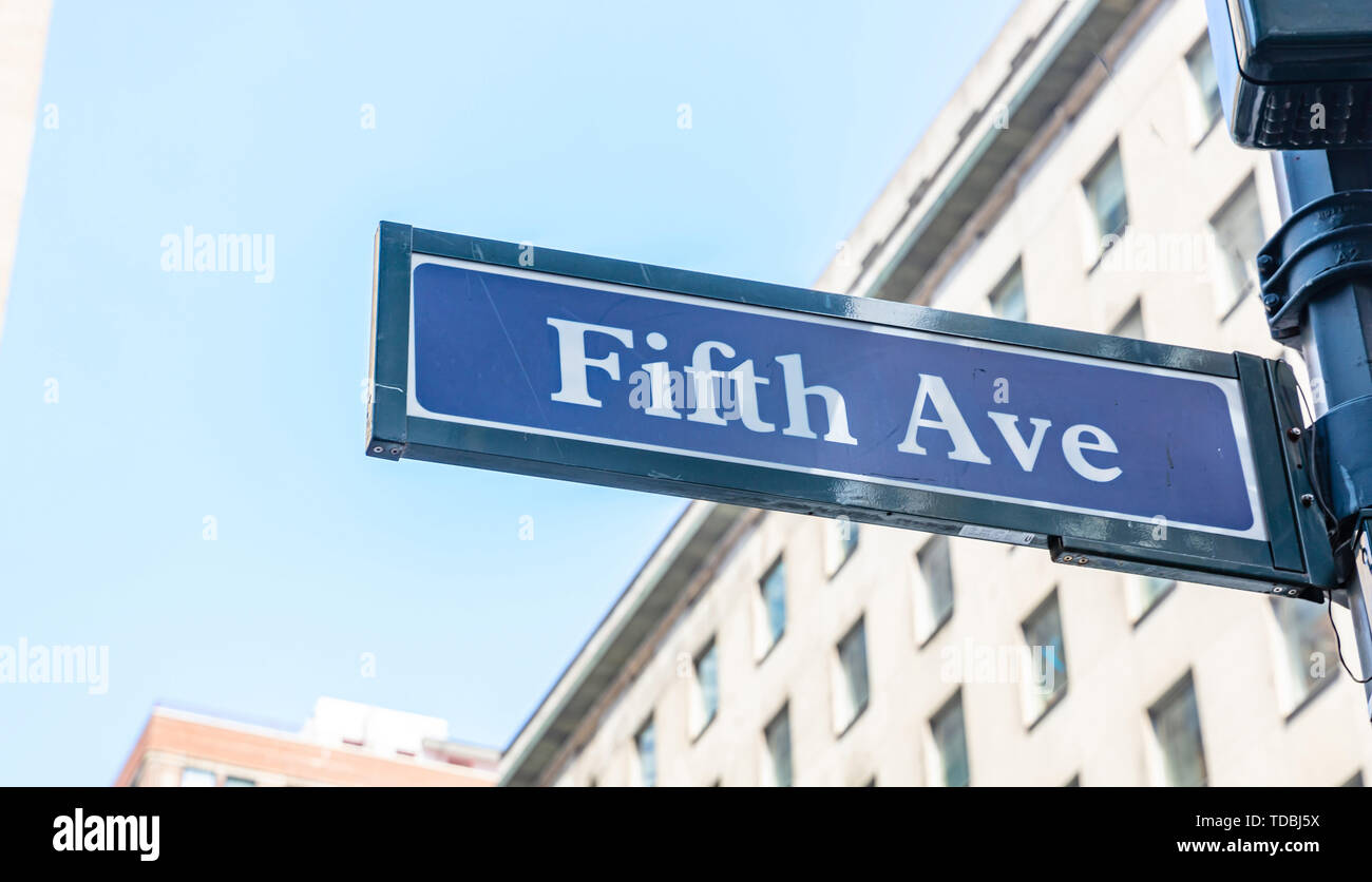 Fifth ave street sign, Manhattan New York downtown. Blue sign on blur ...