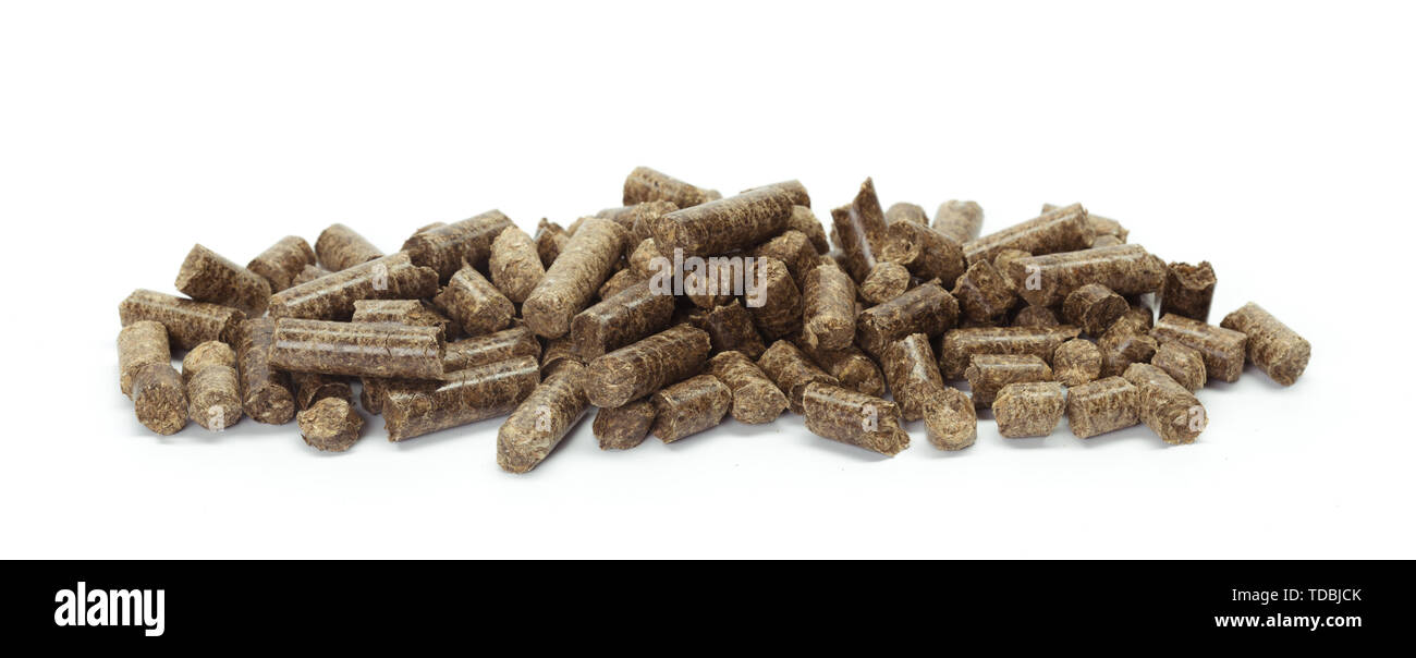 stack of wooden pellets for bio energy, white background, isolated ...