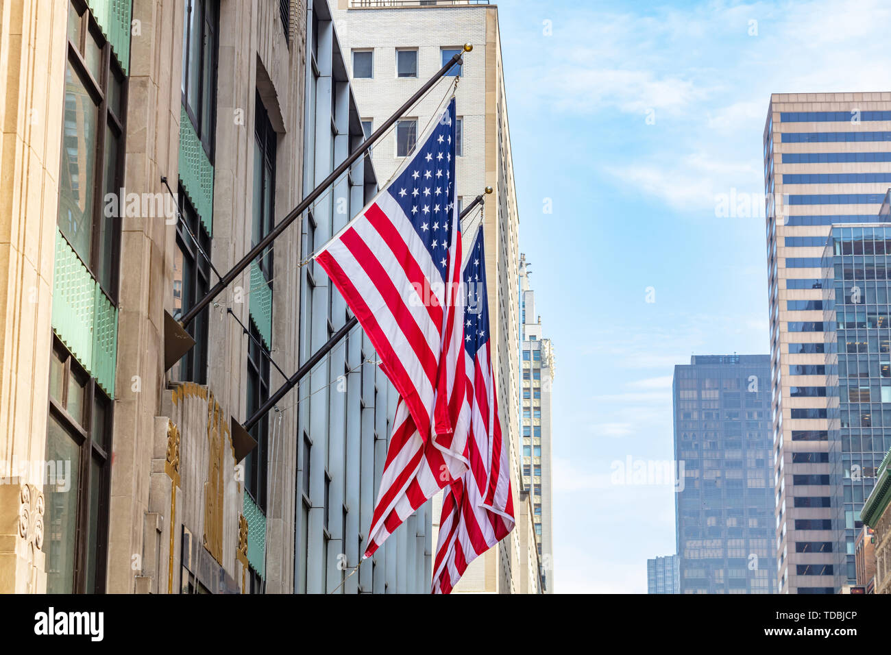 USA symbol in New York streets. American flags on a building facade ...