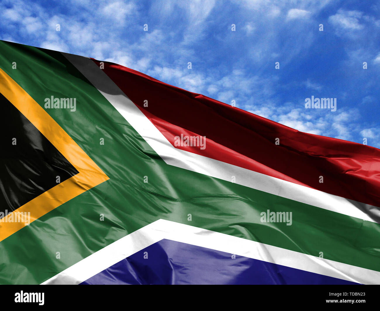 waving flag of South Africa close up against blue sky Stock Photo - Alamy