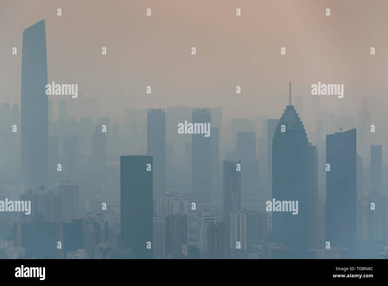 City skyscrapers shrouded in haze Stock Photo - Alamy