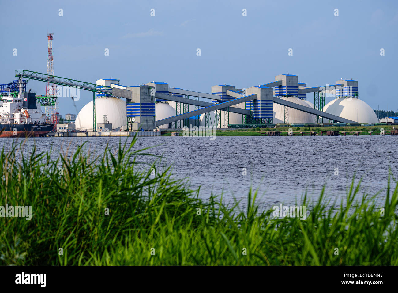 cargo shipping terminals in Riga, Latvia with high wind and dust flying ...