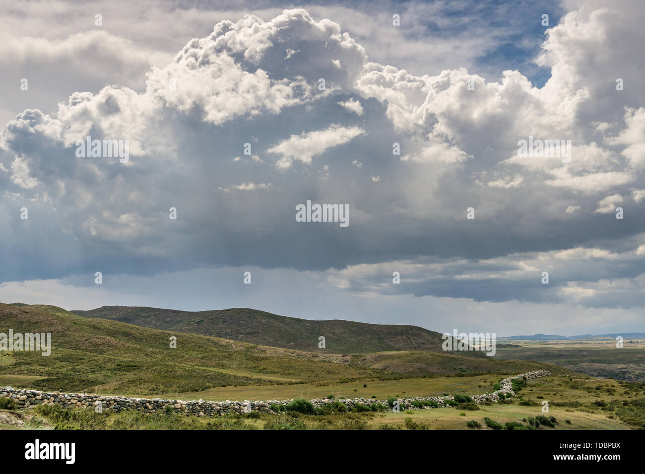 Hillside prairie villages under cloudy clouds Stock Photo - Alamy