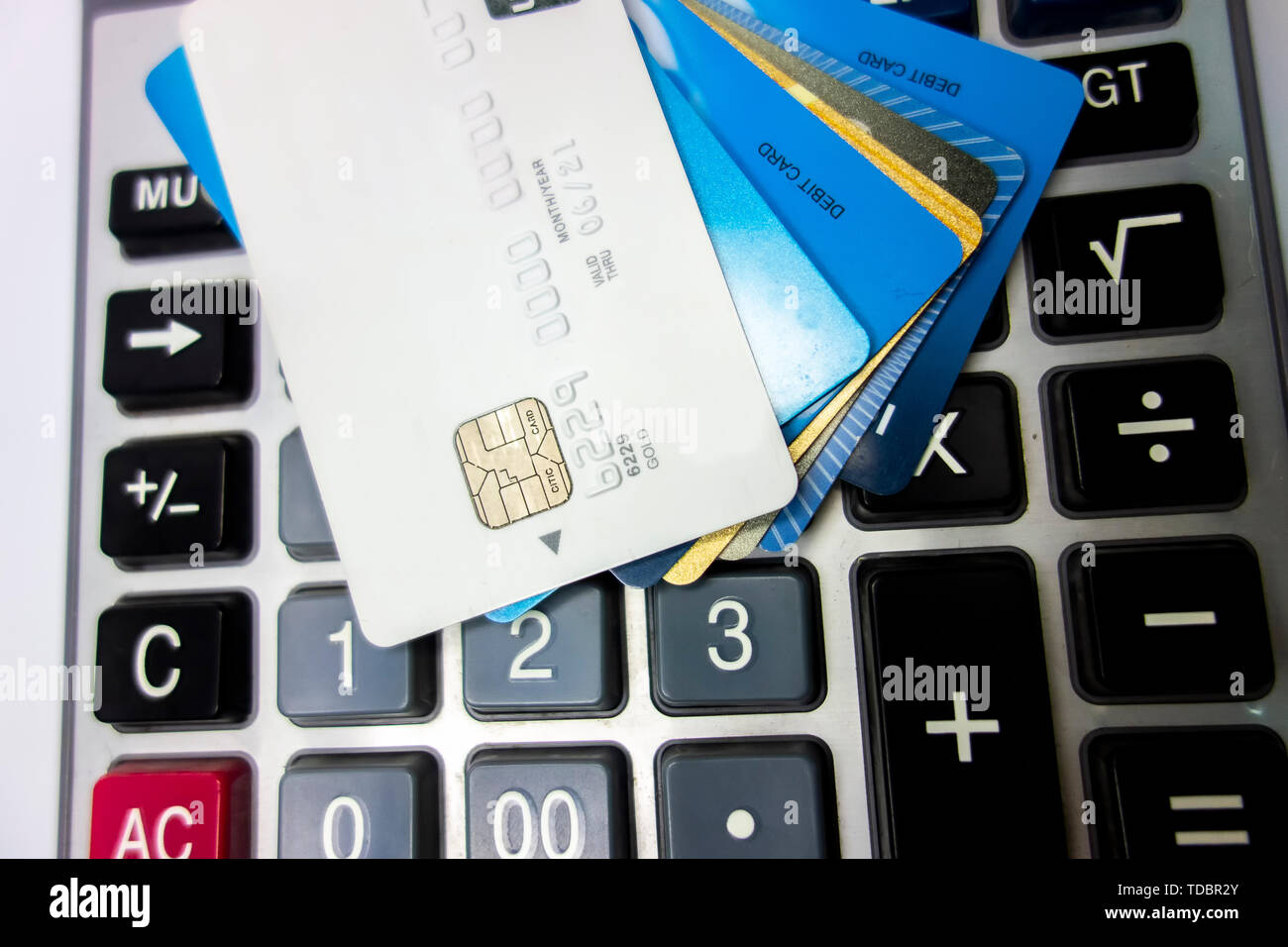 Multiple bank cards and calculators Stock Photo - Alamy