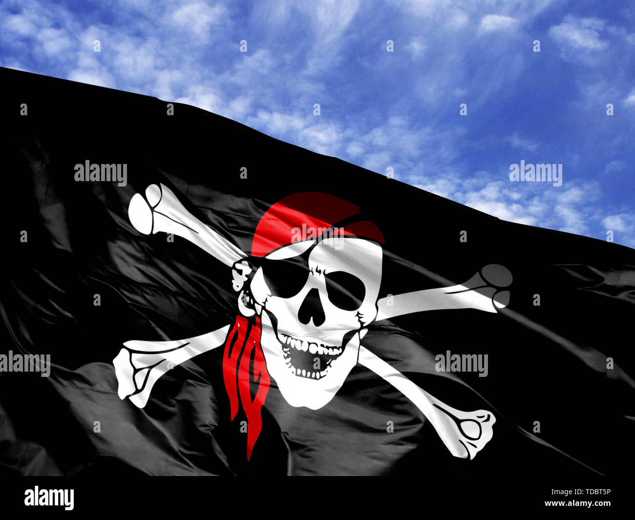waving flag of pirate close up against blue sky Stock Photo - Alamy