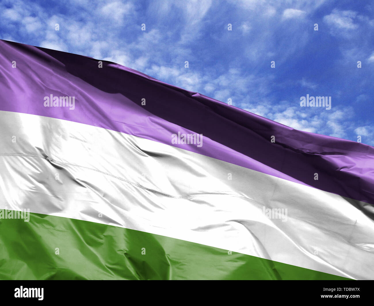 waving flag of genderqueer pride close up against blue sky Stock Photo ...
