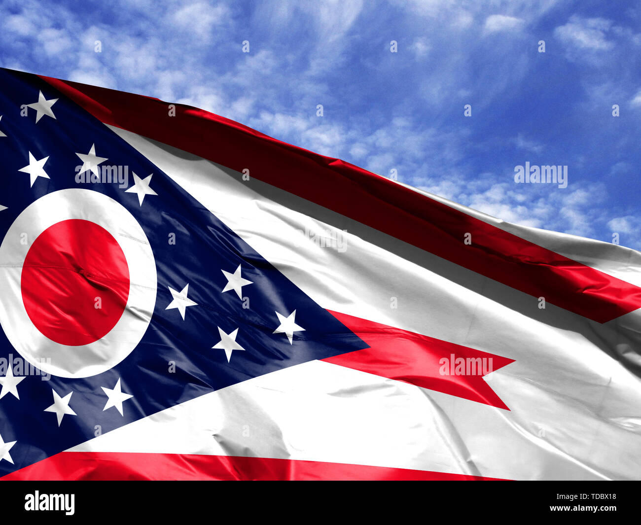 waving flag State of Ohio close up against blue sky Stock Photo - Alamy