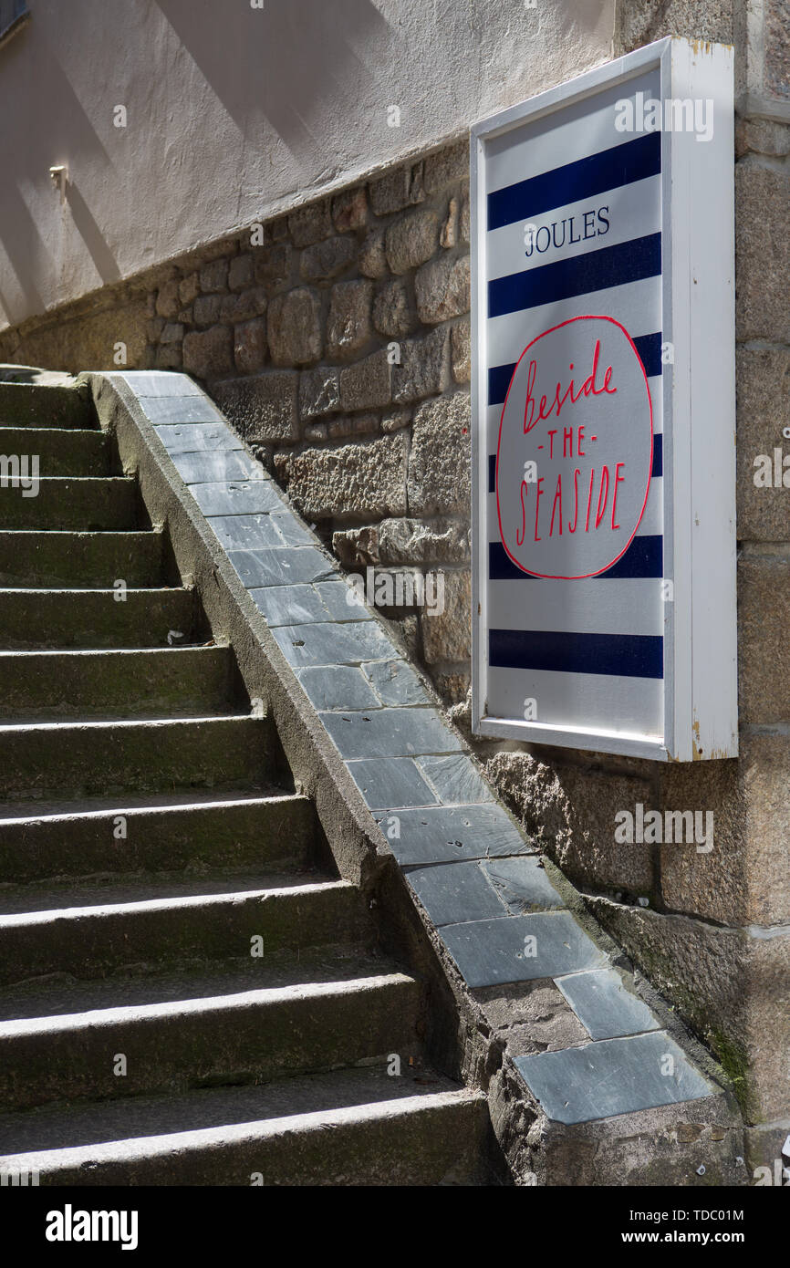 Shop advert and stairs, Fore Street Stock Photo - Alamy