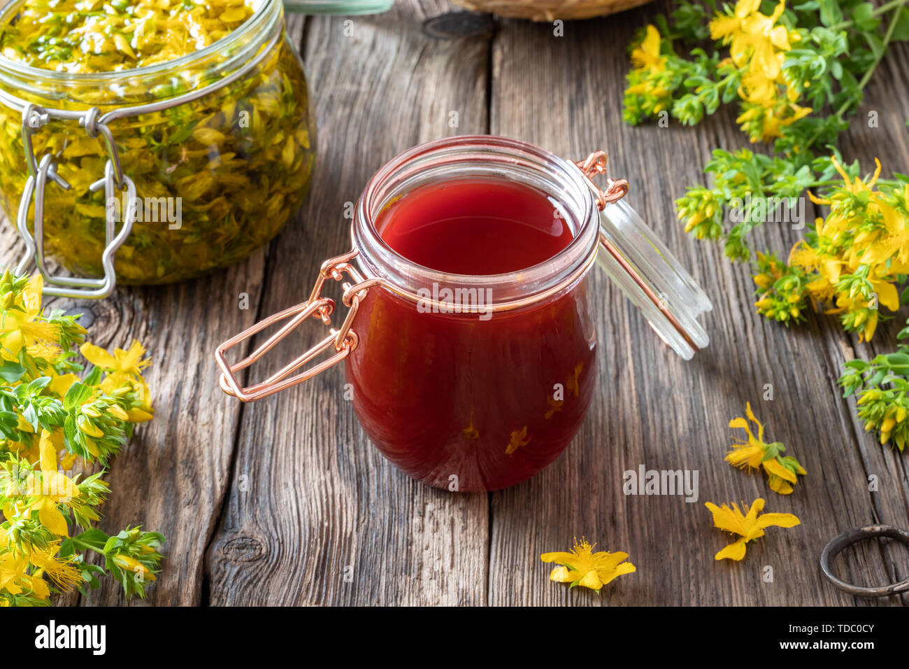 A bottle of red oil made from St. John's wort flowers Stock Photo - Alamy