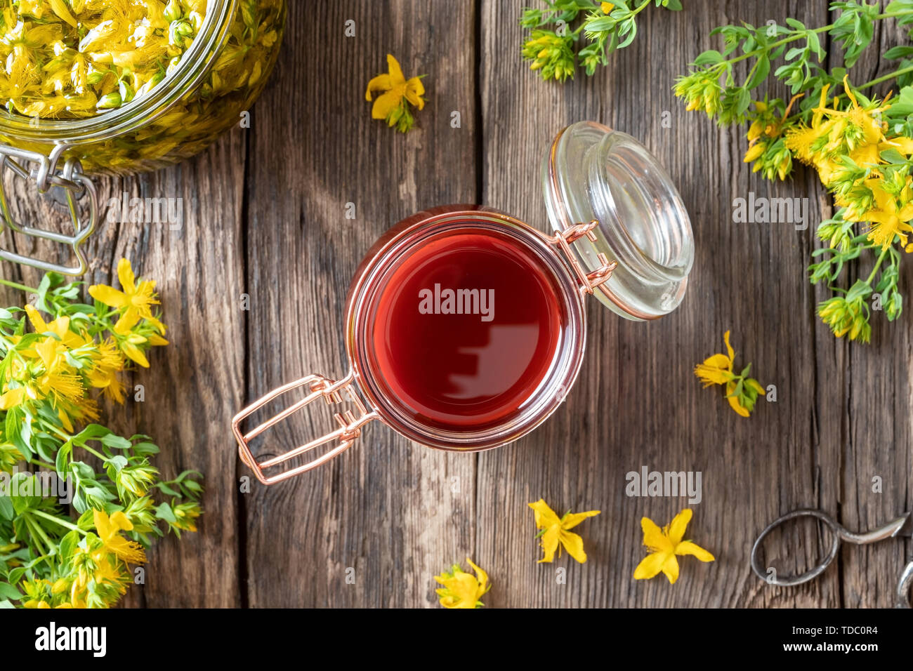 A jar of red oil made from St. John's wort flowers, top view Stock ...