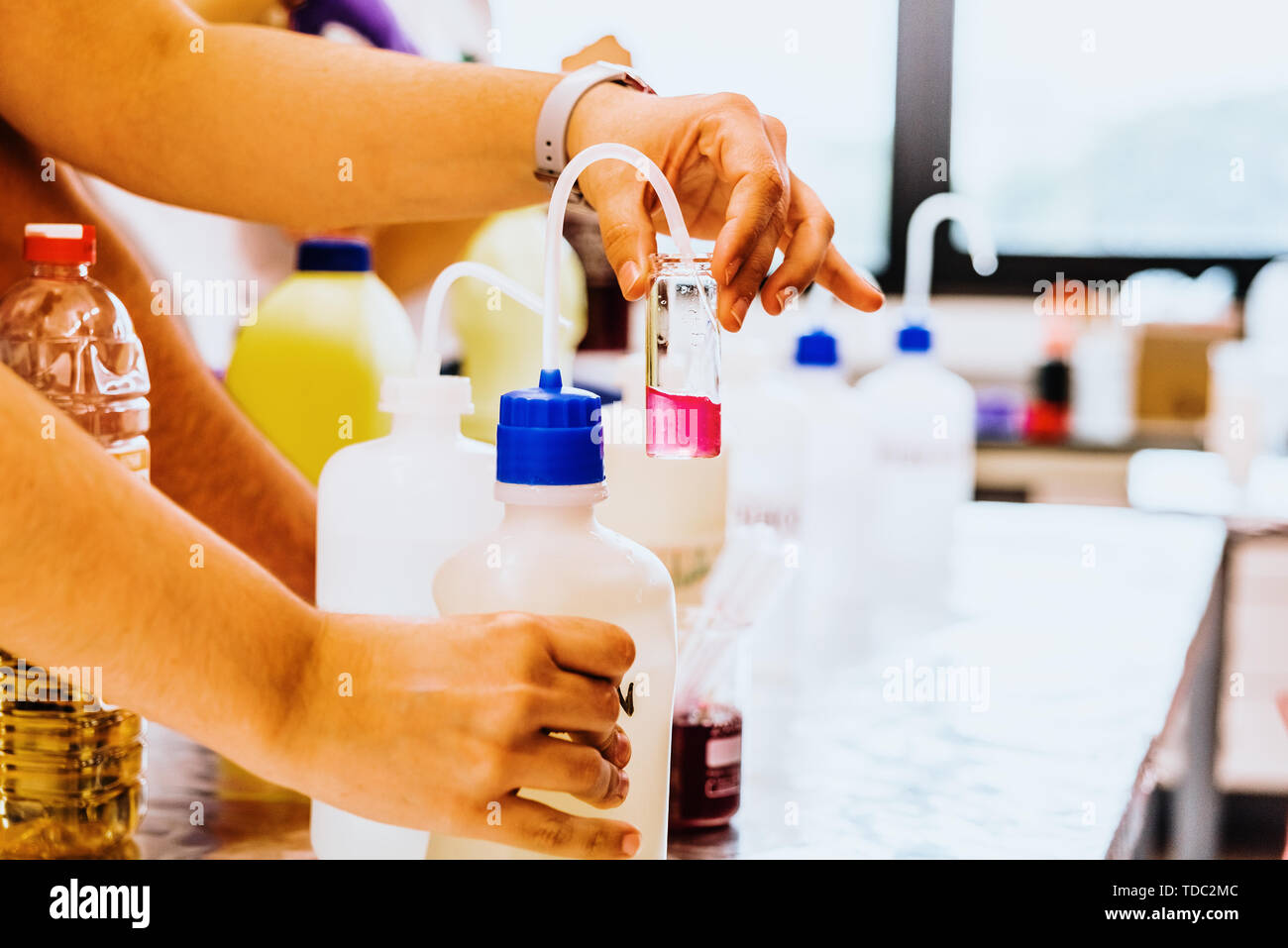 Science teachers in a classroom in a school showing chemistry ...