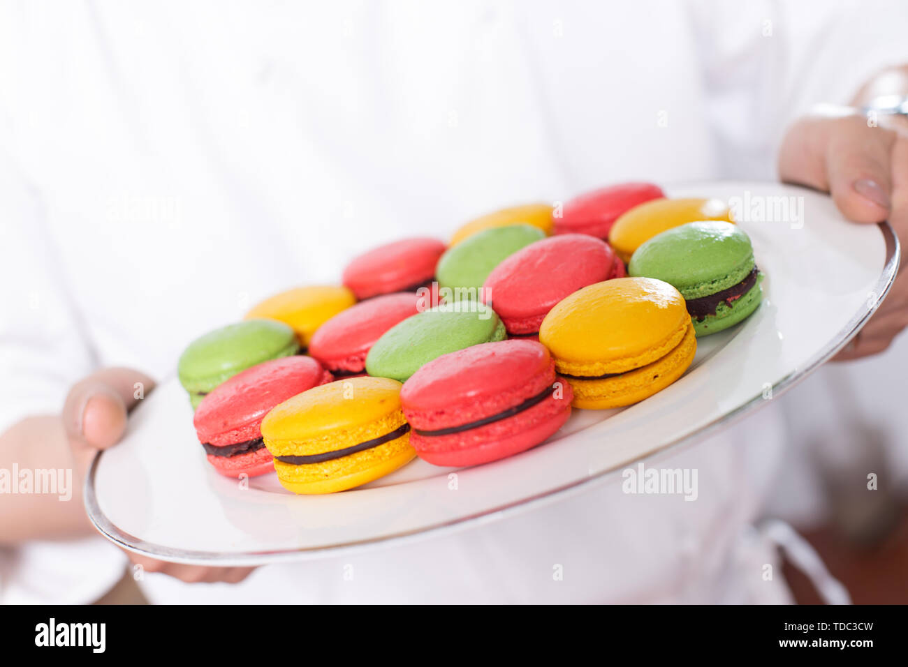 young chinese man chelf making food in modern kitchen Stock Photo - Alamy