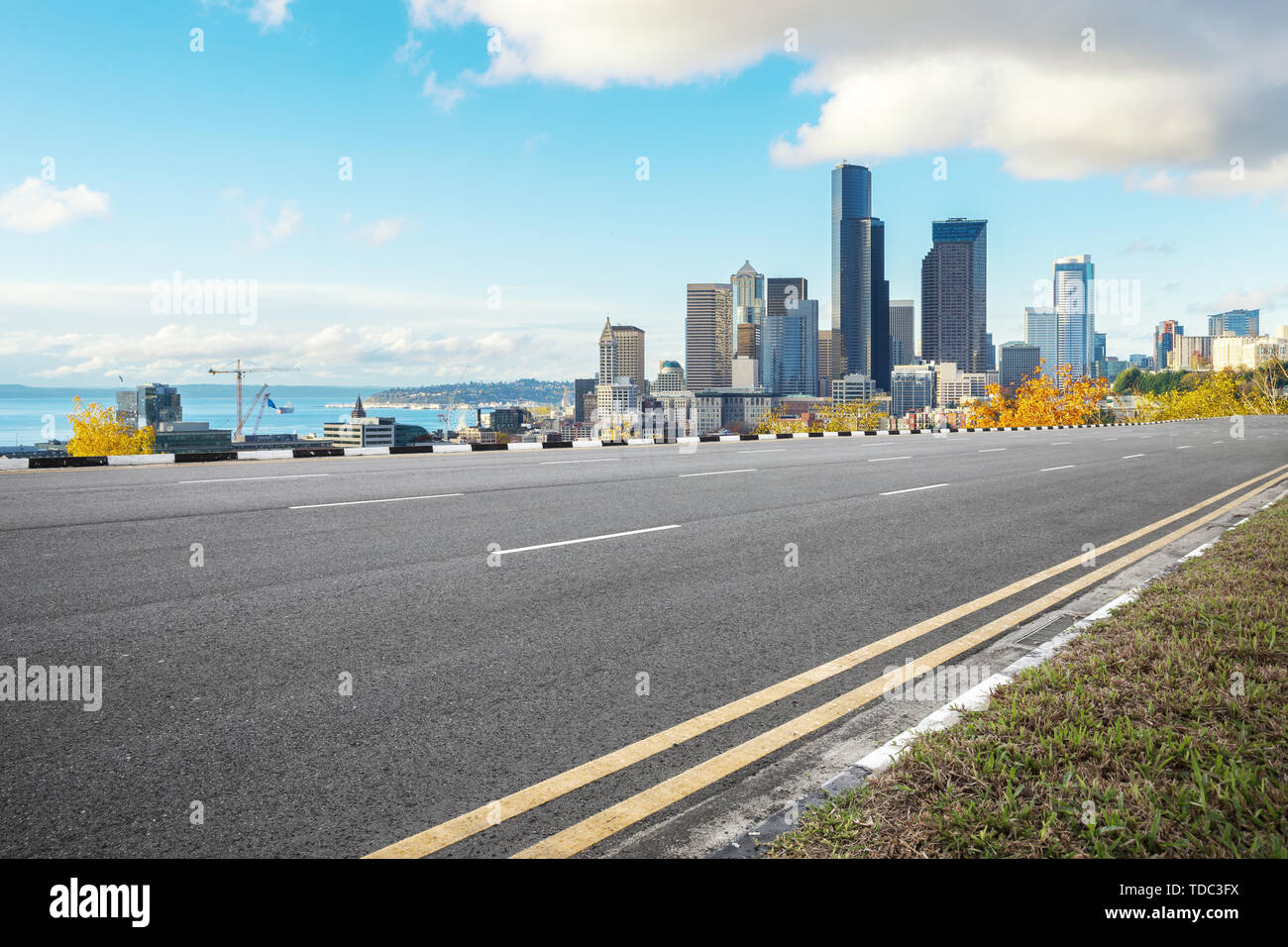 empty asphalt road with cityscape of modern city in blue sky Stock ...