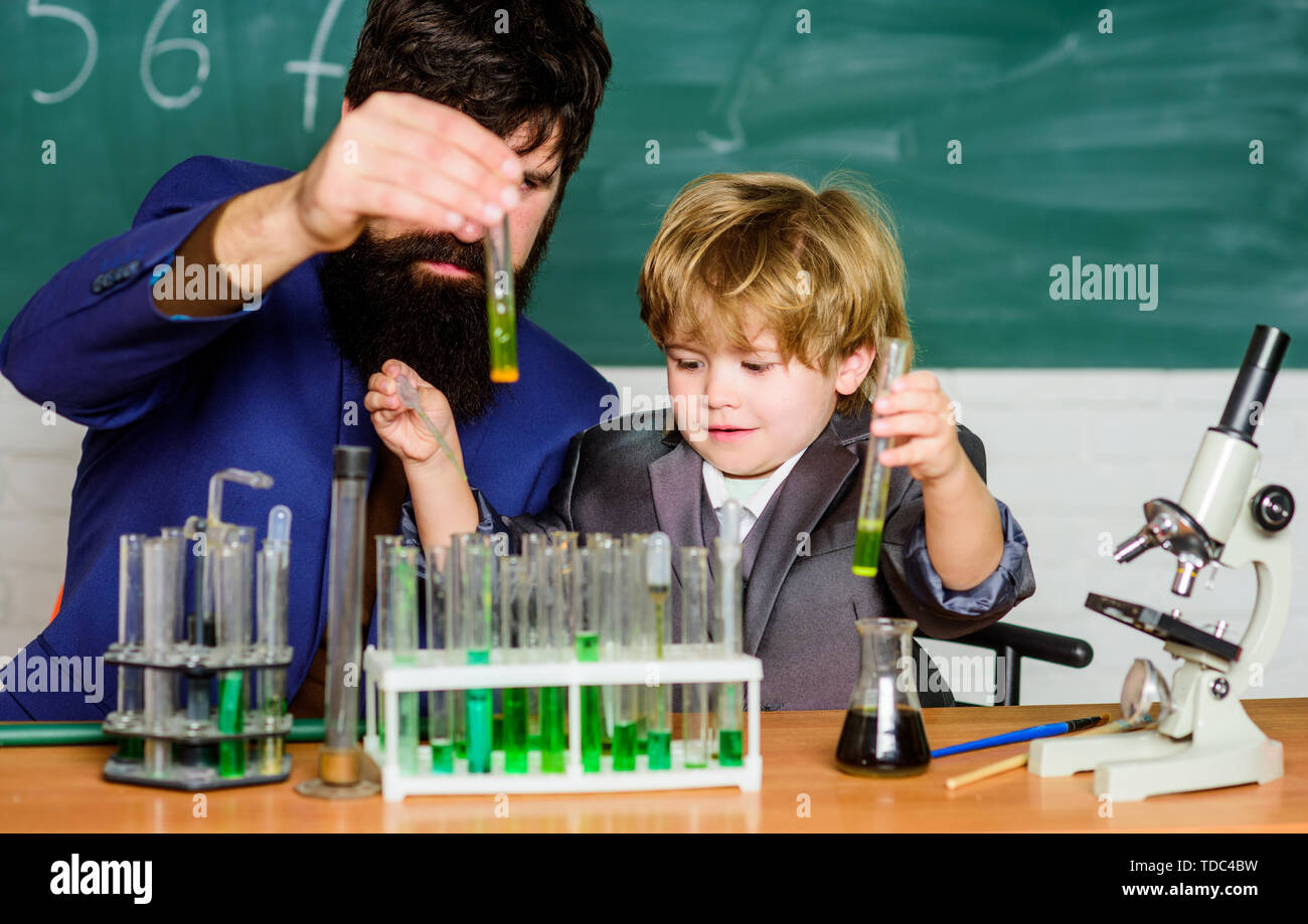 Back to school. Explaining biology to child. father and son at school ...