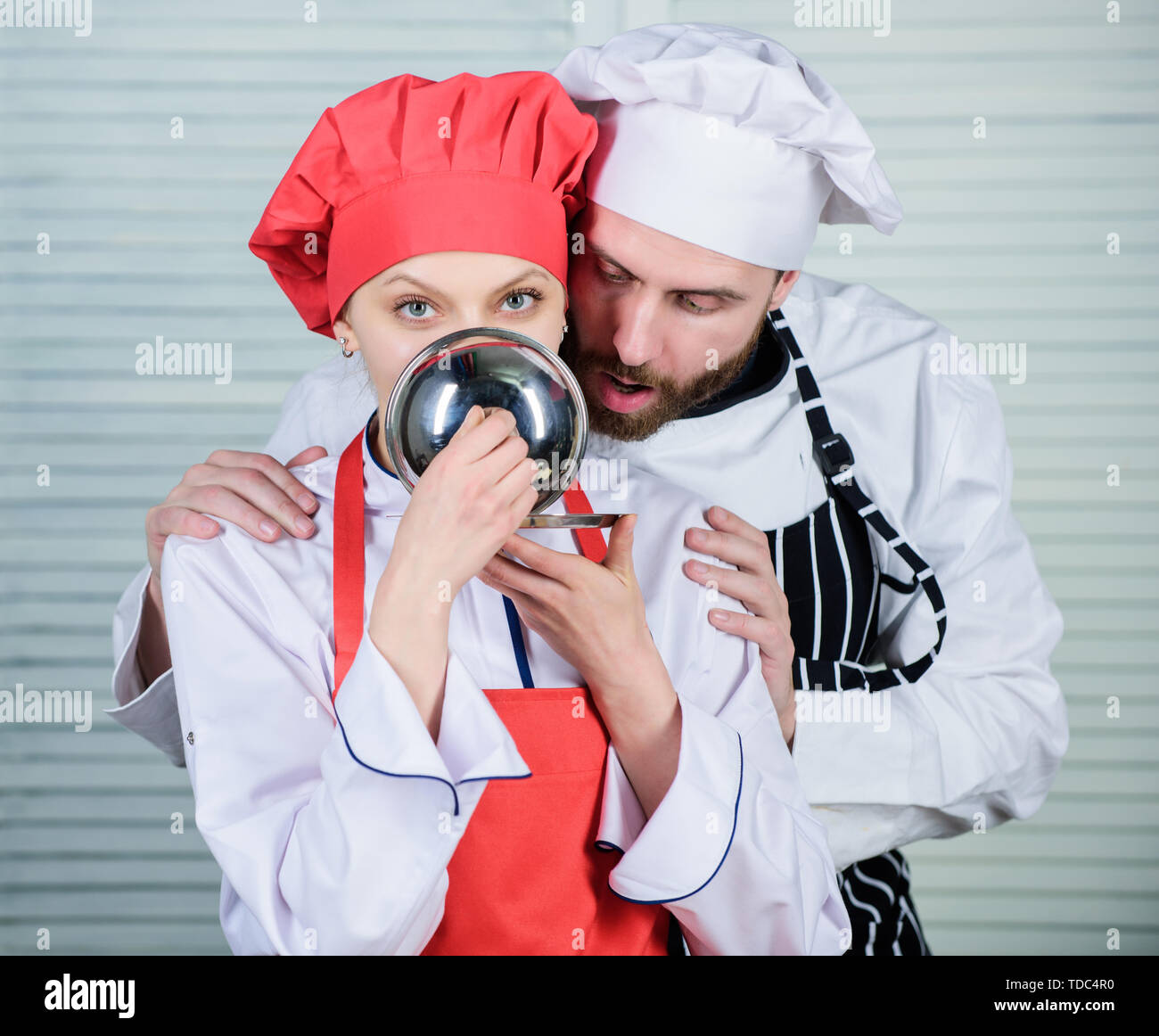 chefs compliment. man and woman chef in restaurant. couple in love with ...