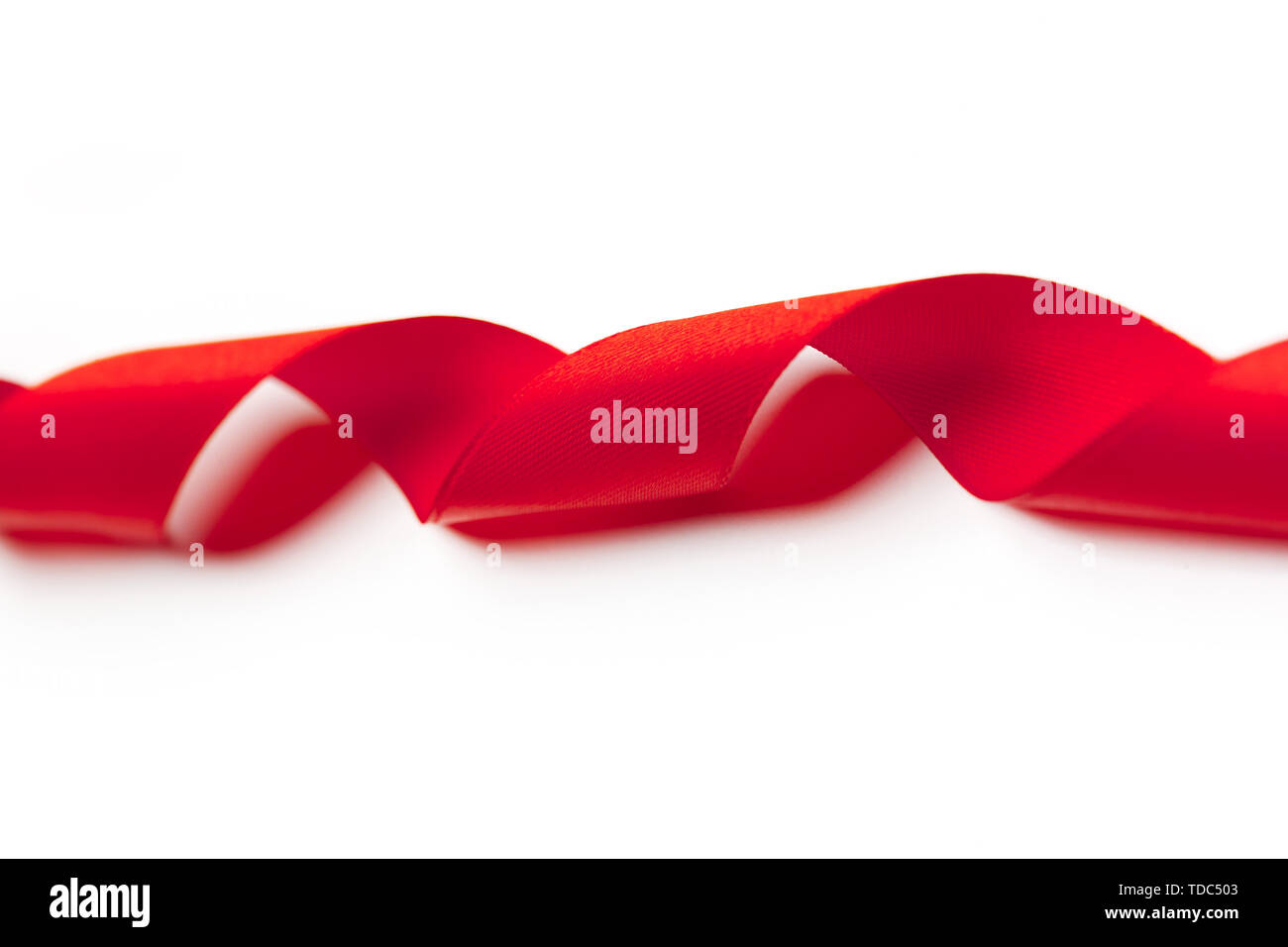 Red ribbon on white background Stock Photo - Alamy