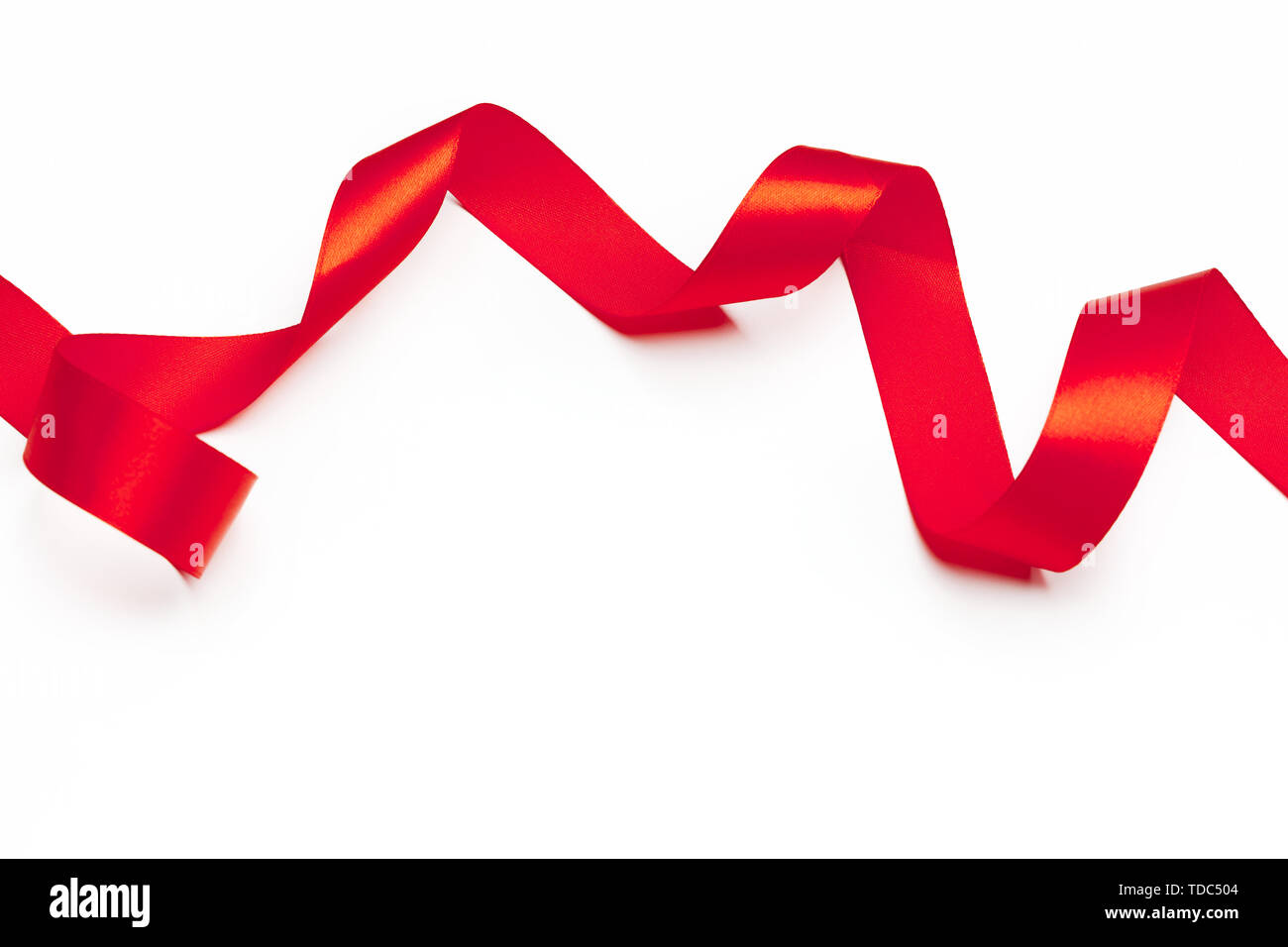 Red ribbon on white background Stock Photo - Alamy