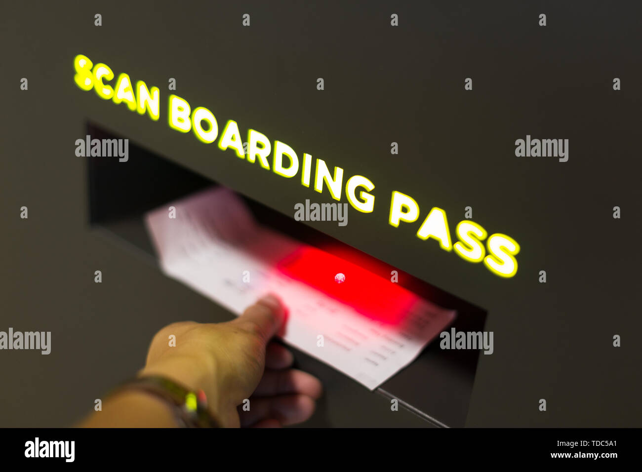 Scan boarding pass in airport Stock Photo - Alamy