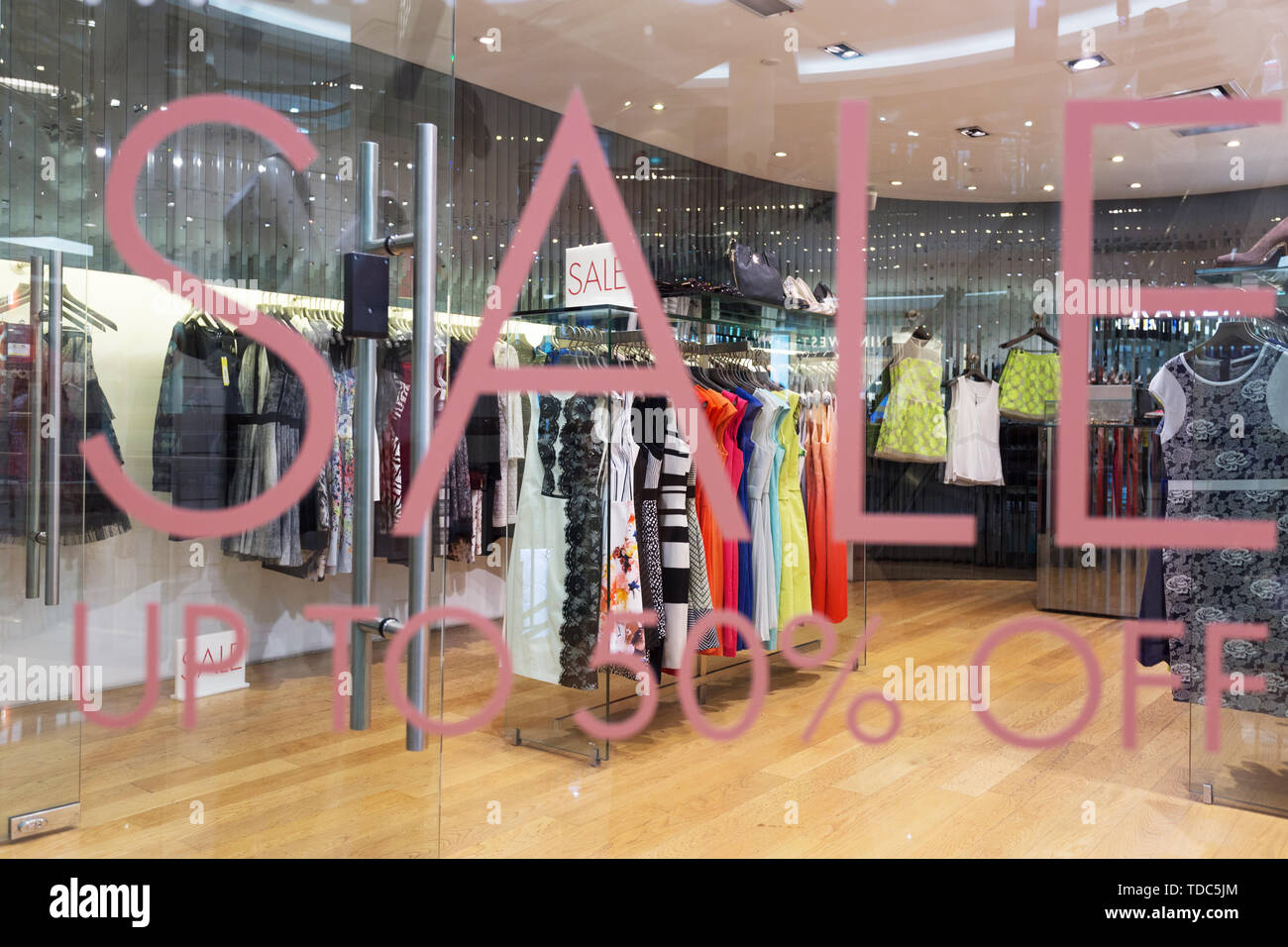 Sign of sale on display window Stock Photo - Alamy