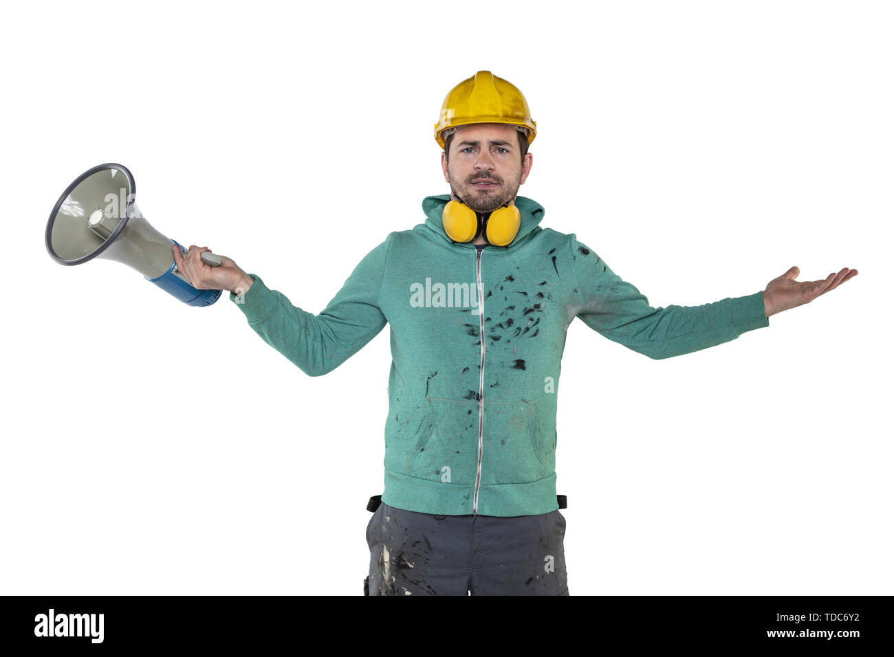 the construction worker holds a megaphone in his hands, the concept of ...