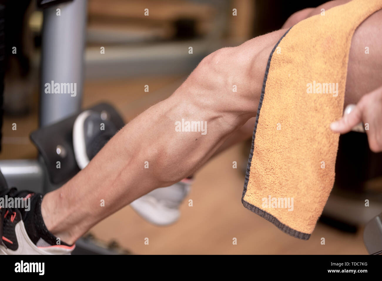 Handsome strong man performed leg press workout in the gym Stock Photo ...