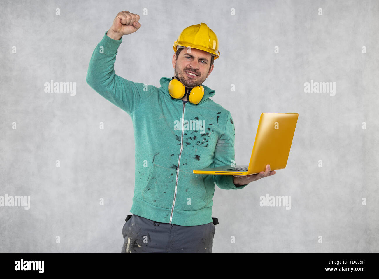modern building supervisor keeps the computer in his hands, technology ...