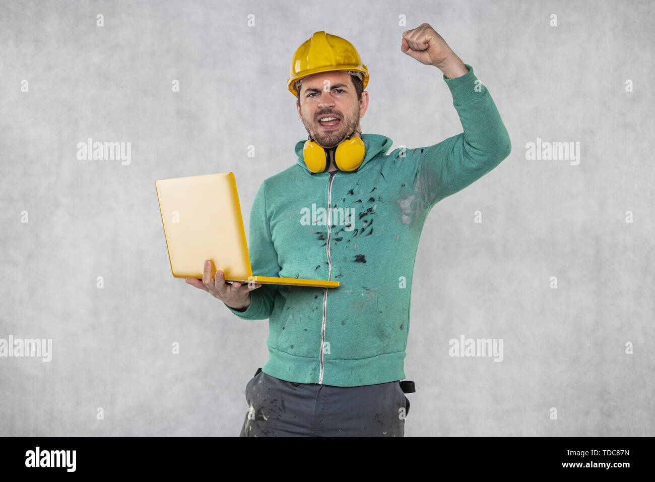 modern building supervisor keeps the computer in his hands, technology ...