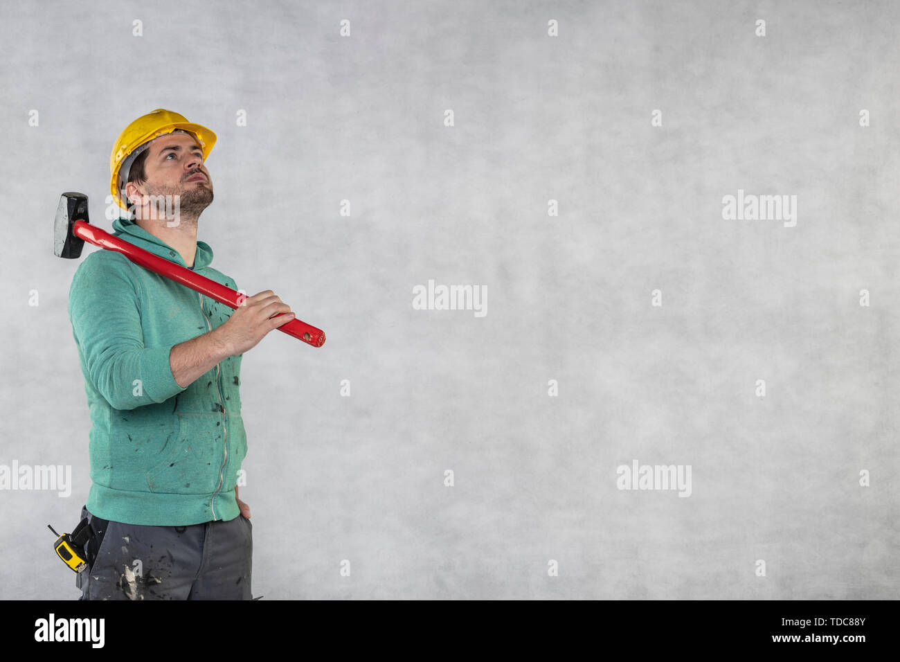 construction worker with a hammer in hand, concept of construction and ...