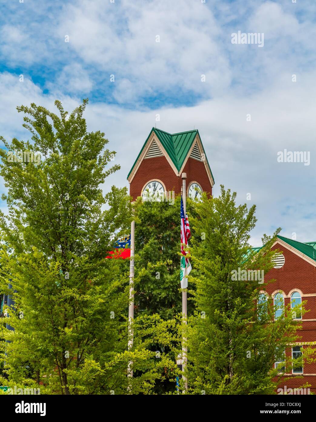 A modern brick courthouse beyond green trees Stock Photo - Alamy