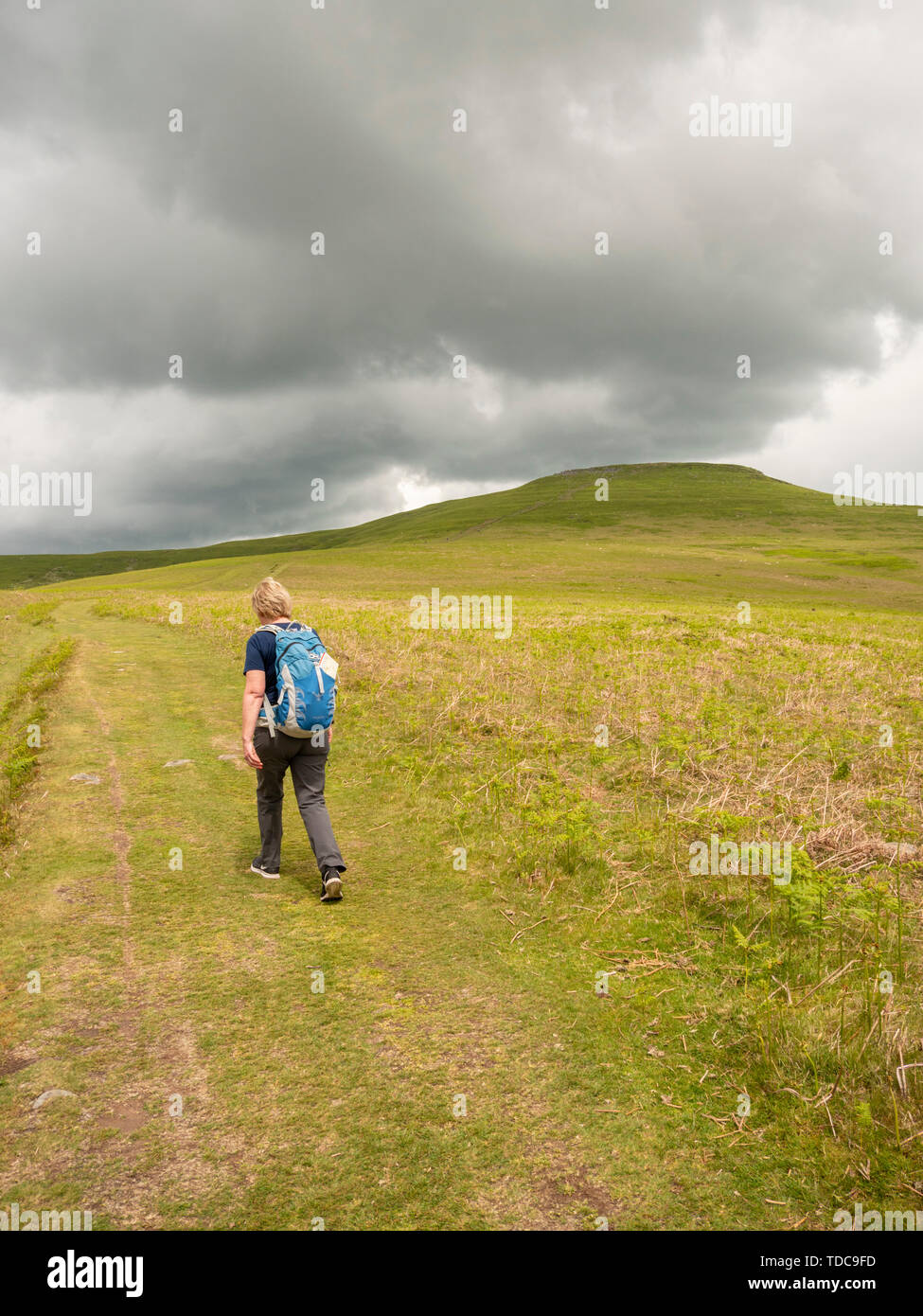 Woman walking up mountain hi-res stock photography and images - Alamy