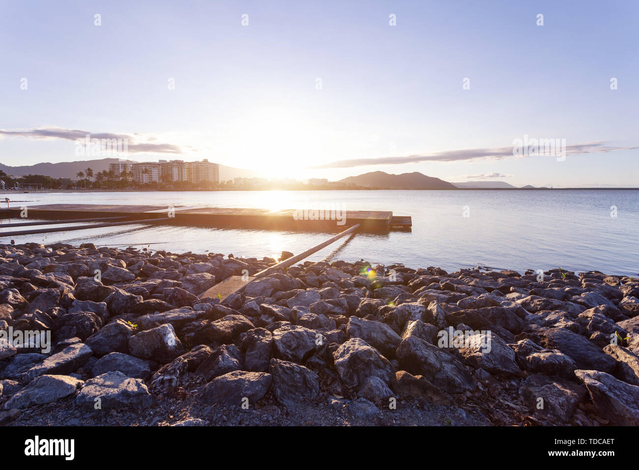 Beautiful rocky beach at sunrise Stock Photo - Alamy