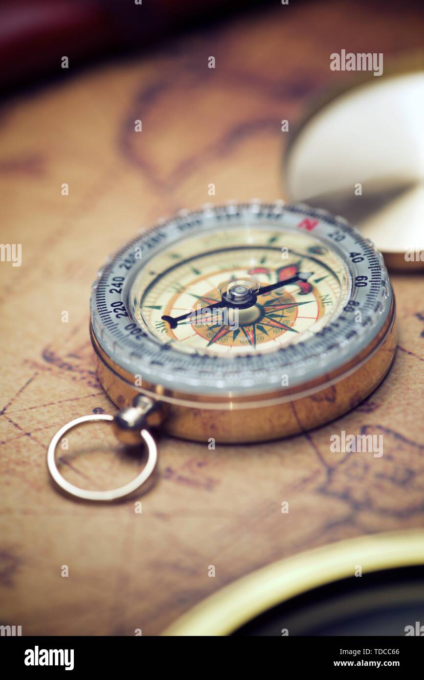 Vintage compass and old navigation map Stock Photo - Alamy
