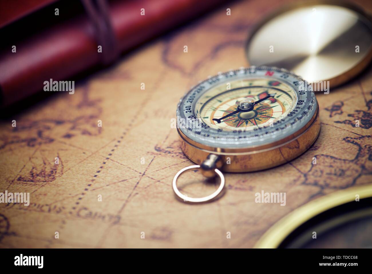 Vintage compass and old navigation map Stock Photo - Alamy