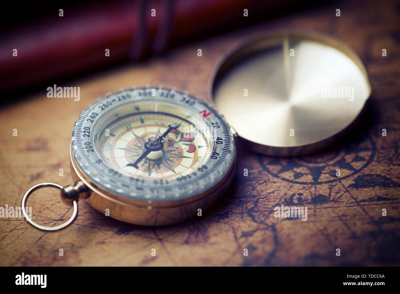 Vintage compass and old navigation map Stock Photo - Alamy