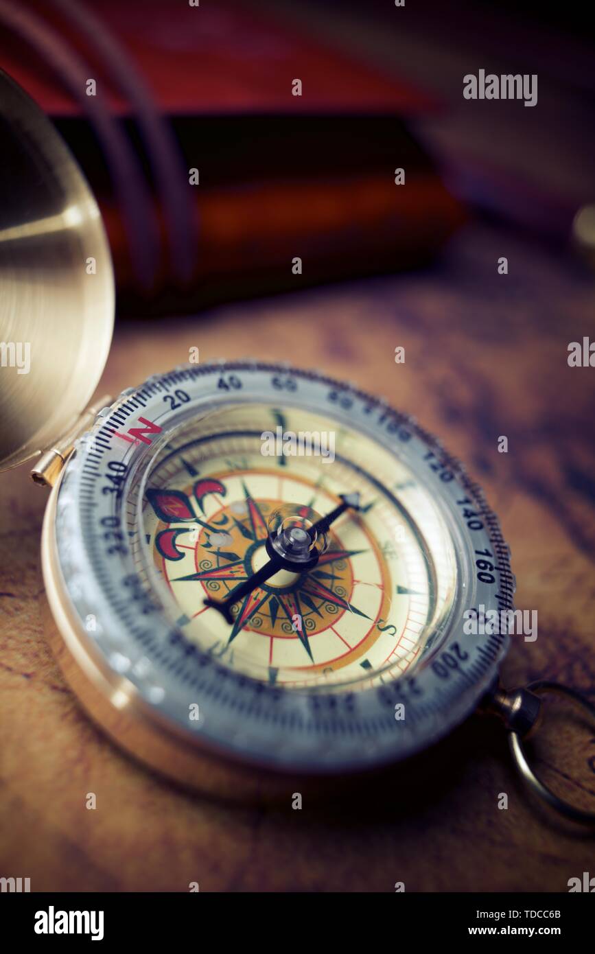 Vintage compass and old navigation map Stock Photo - Alamy