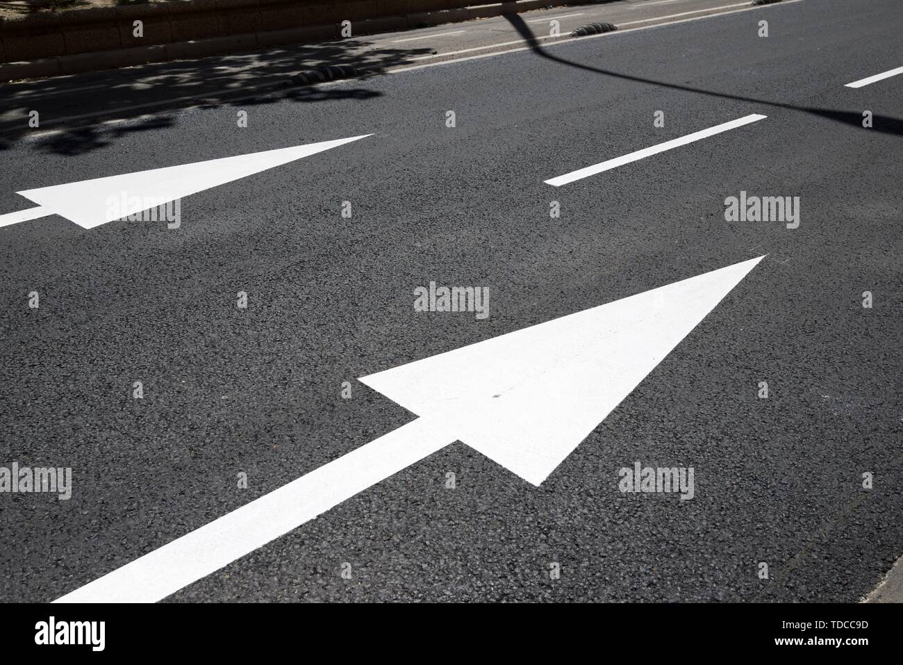 Two arrow directional signals on the floor Stock Photo - Alamy
