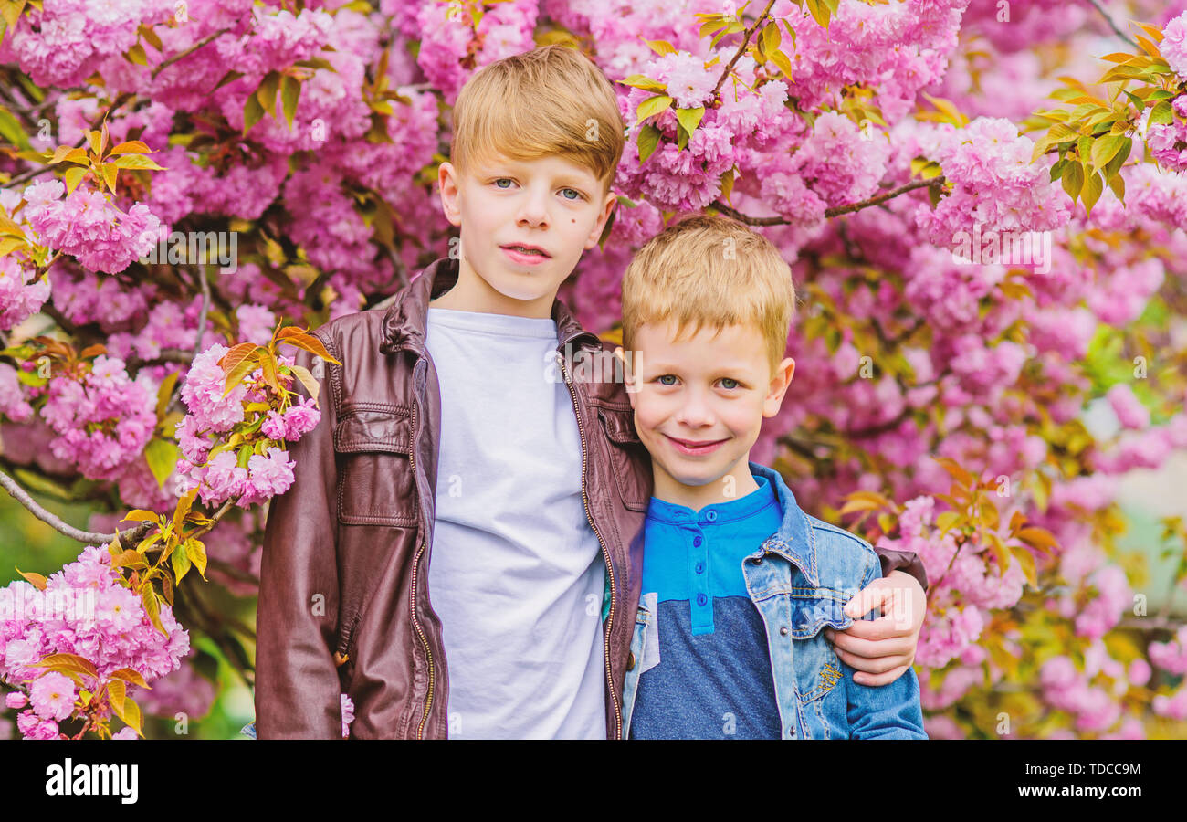 Brotherhood concept. Happy spring holidays. Children enjoy warm spring ...