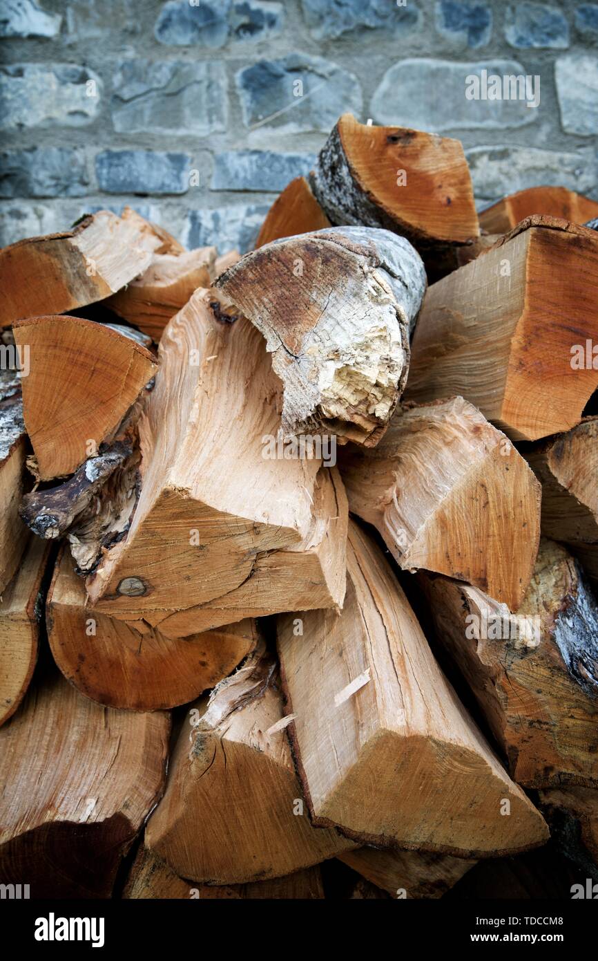Background created with stacked firewood Stock Photo - Alamy