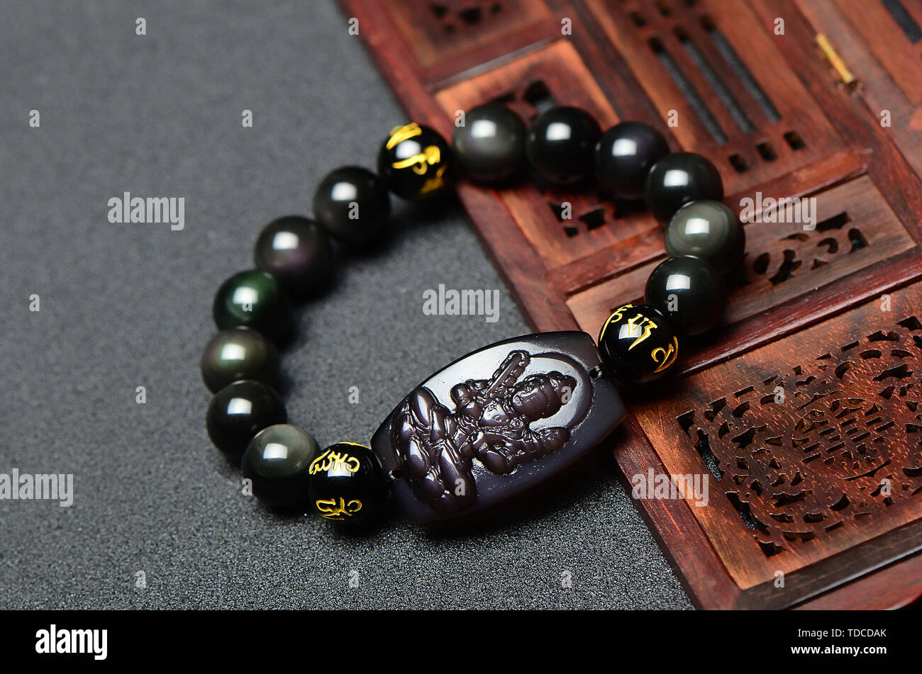 Eight patron saint obsidian bracelets Stock Photo - Alamy