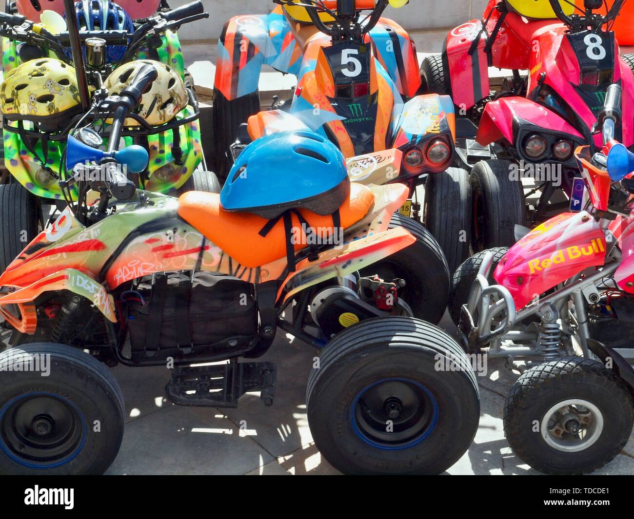 Colorful motor buggies with helmets outside Stock Photo - Alamy
