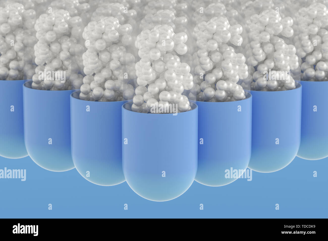 Blue granular capsule, 3-D rendering Stock Photo - Alamy