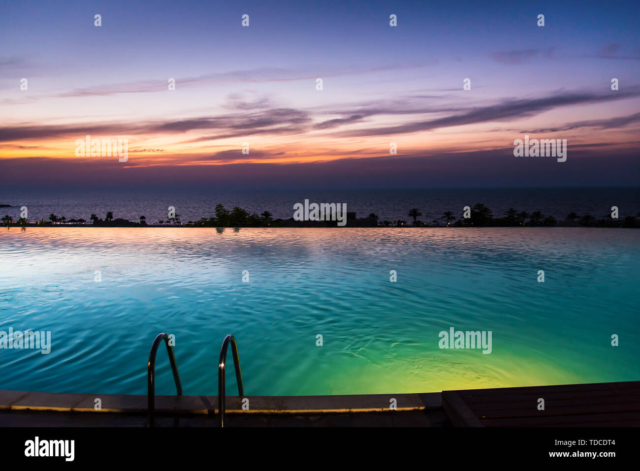 Empty swimming pool by sea at dusk hi-res stock photography and images ...